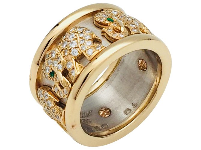 Cartier band ring "Elephants", two golds, diamonds and emeralds. White ...