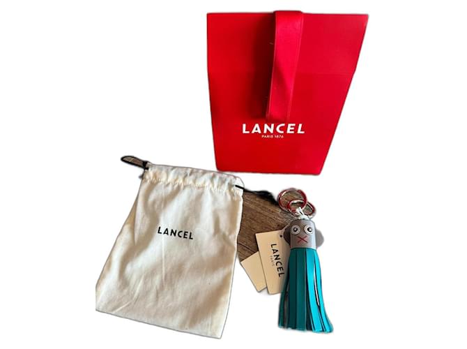 Lancel pompom bag charm & key ring Turquoise Leather ref.2000489 - Joli ...