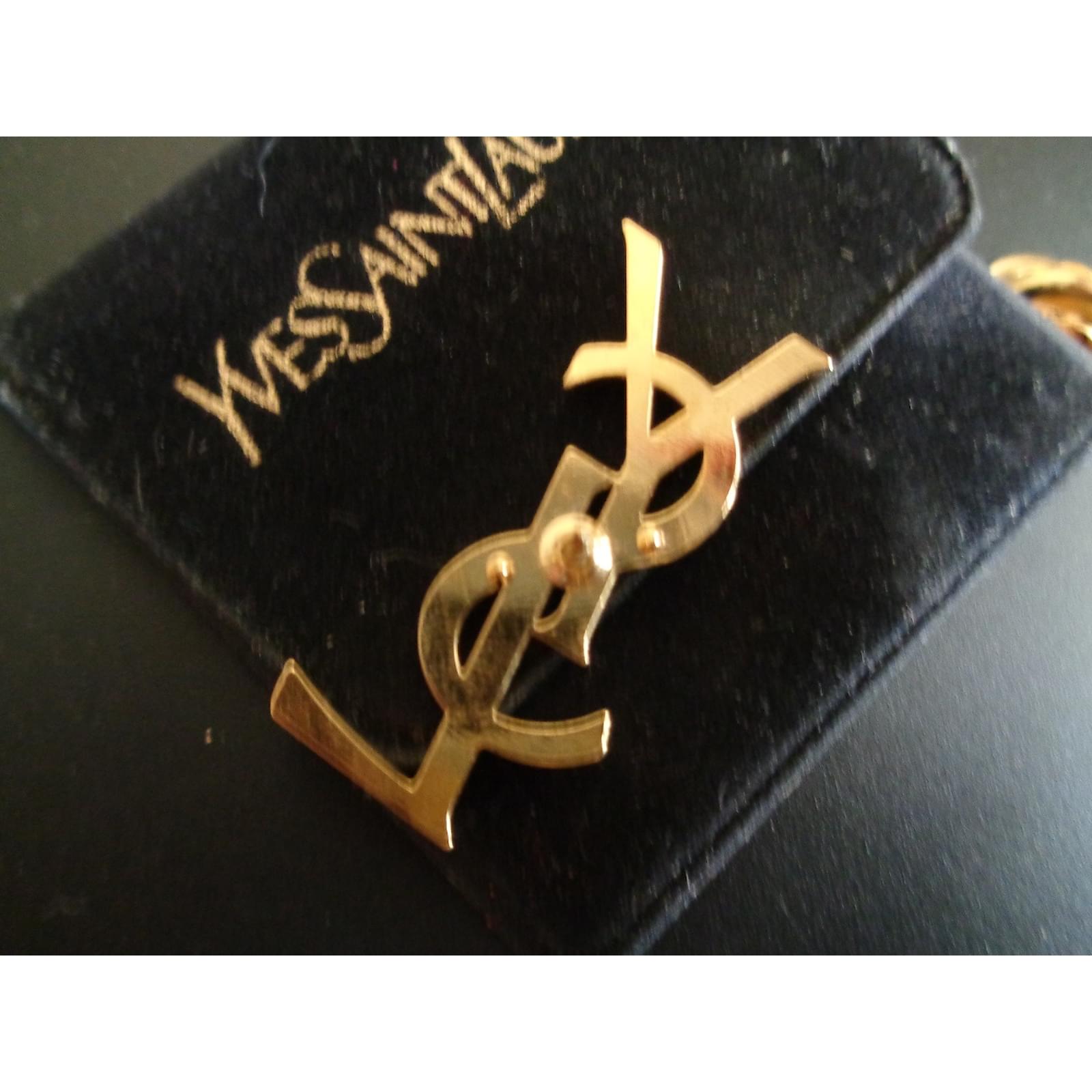 Yves Saint Laurent Pins & brooches Golden Metal ref.49924 - Joli Closet