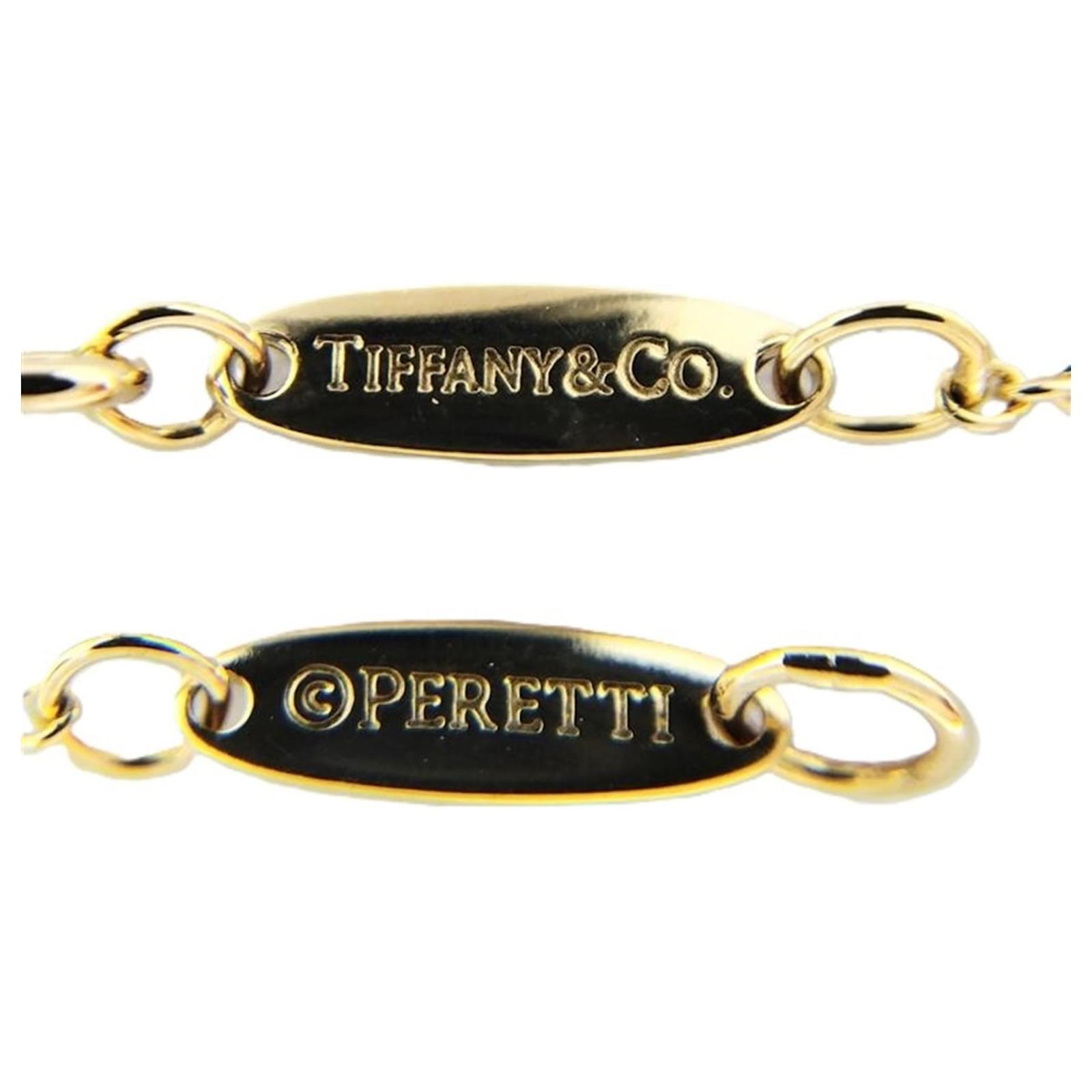Collier croix petit modèle Elsa Peretti de Tiffany & Co. Or blanc Doré ...