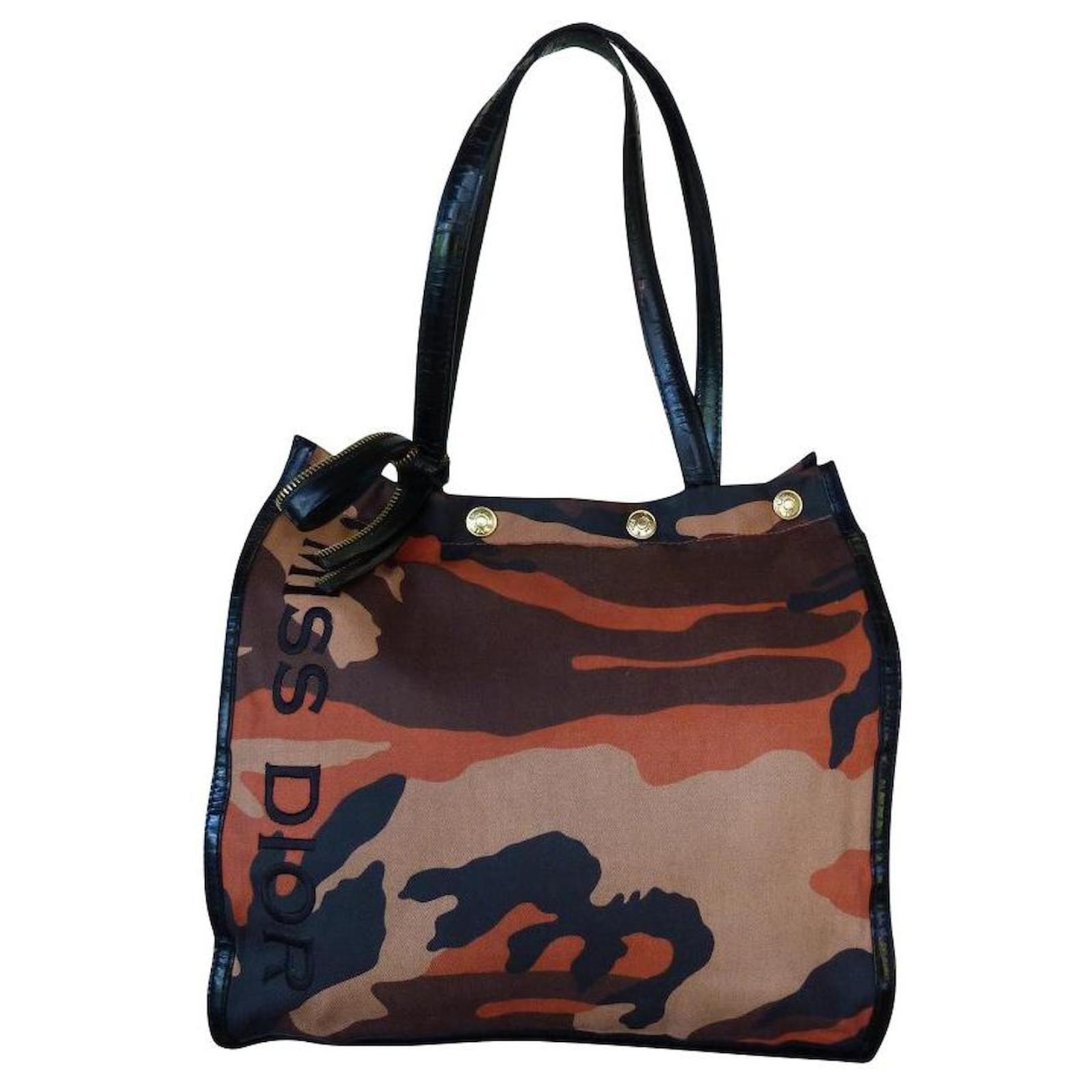 Dior Handbags Brown Black Orange Cloth ref.605451 - Joli Closet