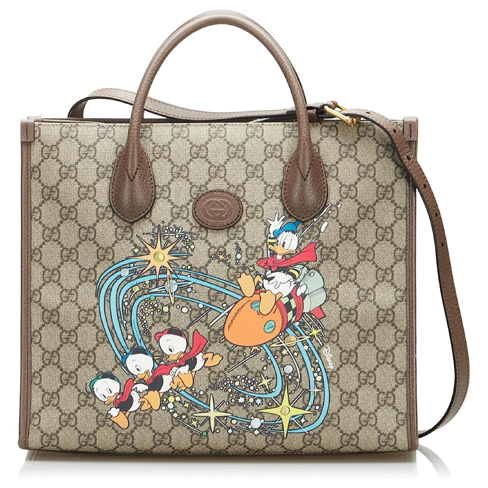 Gucci marrón x Disney pequeño GG Supreme Donald Duck Satchel Castaño ...
