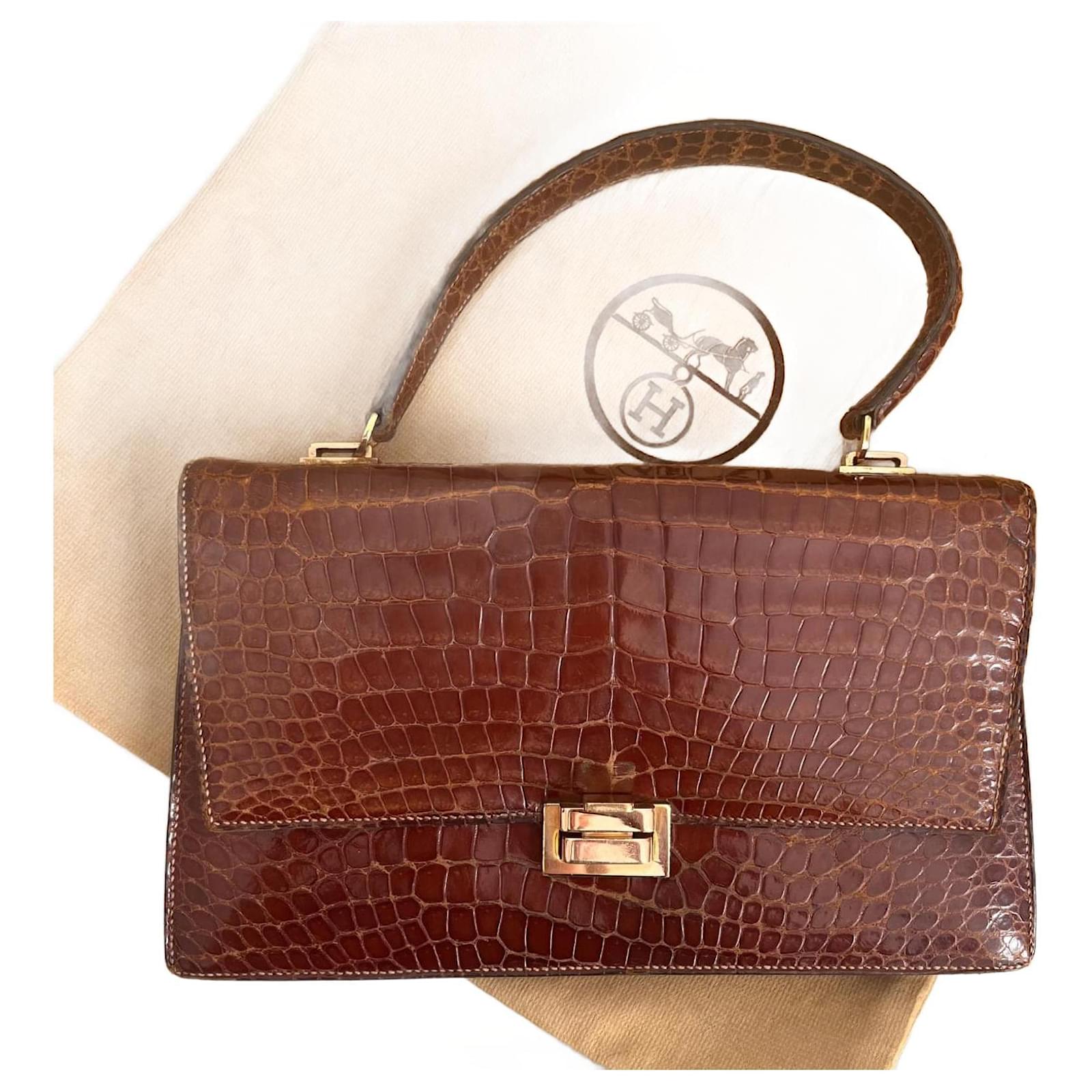 Ring Hermès Palermo bag, a rare bag in the style of the 60s Dark brown ...