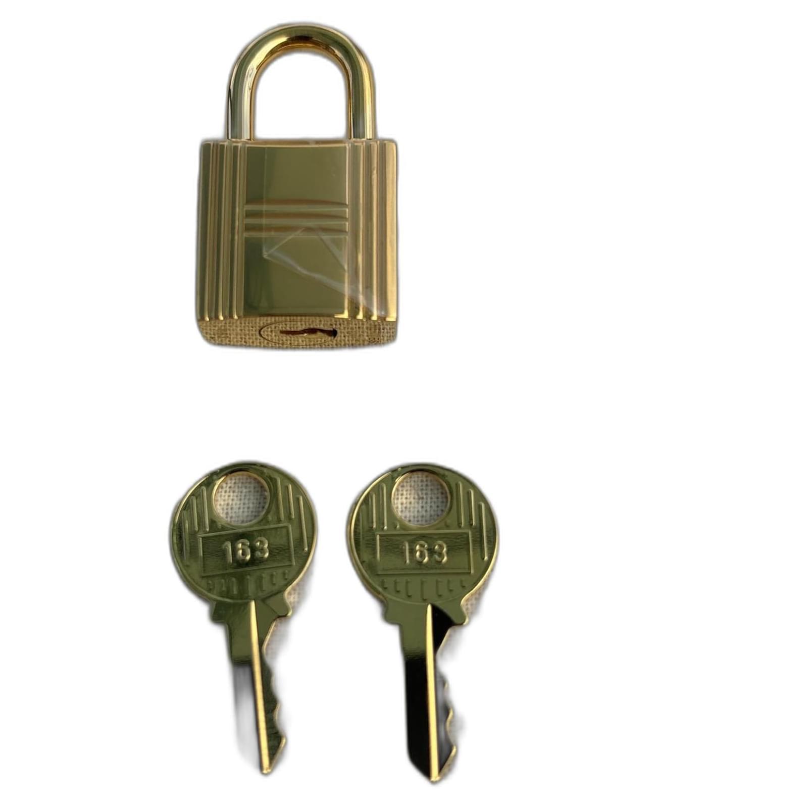 Brand new Hermès Kelly and Birkin padlocks. Gold hardware Steel ref ...