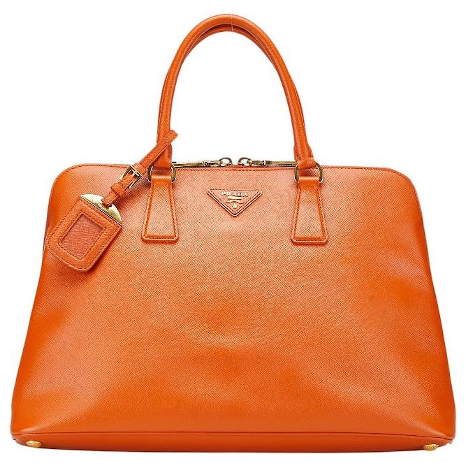 Double Prada Triangle Logo Plate Leather Handbag Orange ref.2469542 ...